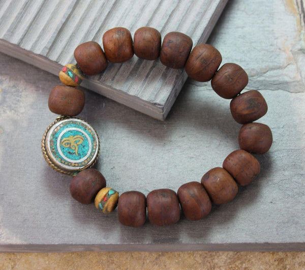 Old Bodhi Seed and Tibetan OM Inlaid Bead Wrist Mala - DharmaShop