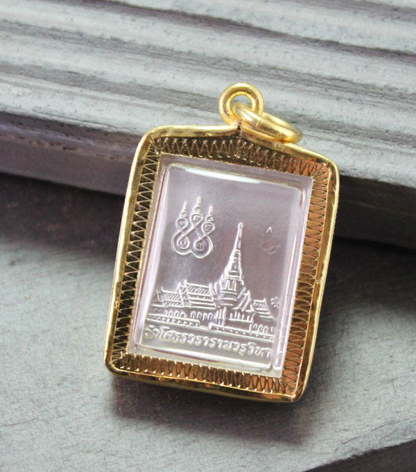 Red Thai Buddha in Gold Case Amulet - DharmaShop